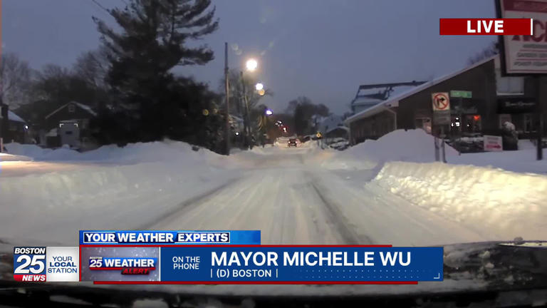 Boston cleans up after powerful winter storm dumps nearly two feet of snow