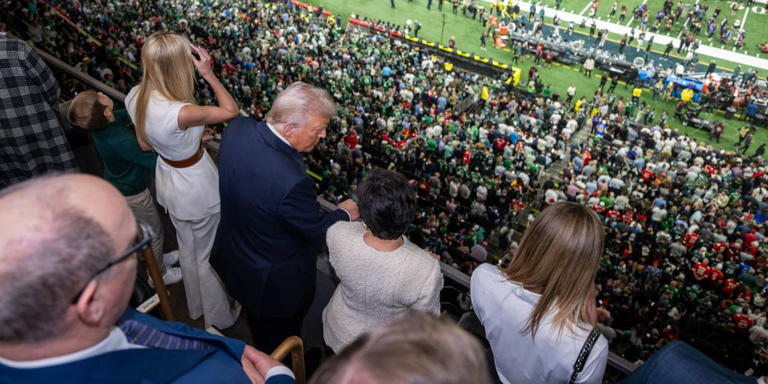Trump sparks loud cheers during national title night in Miami