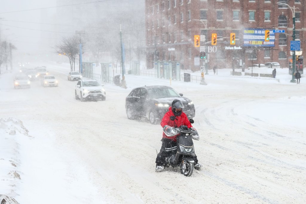 Snow day: Toronto digs itself out of mountains of snow after record storm