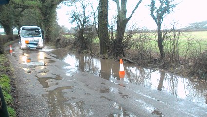 Wield potholes create a slalom course for this lorry driver