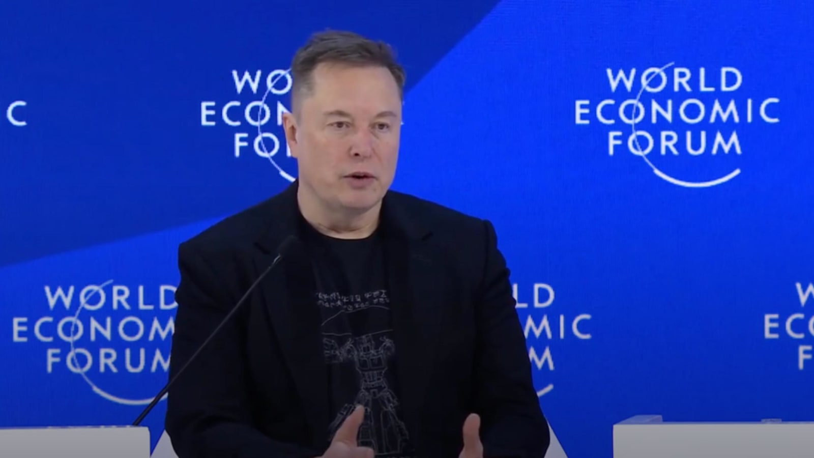 Elon Musk tells Davos he is an 'alien' as BlackRock CEO Larry Fink looks on