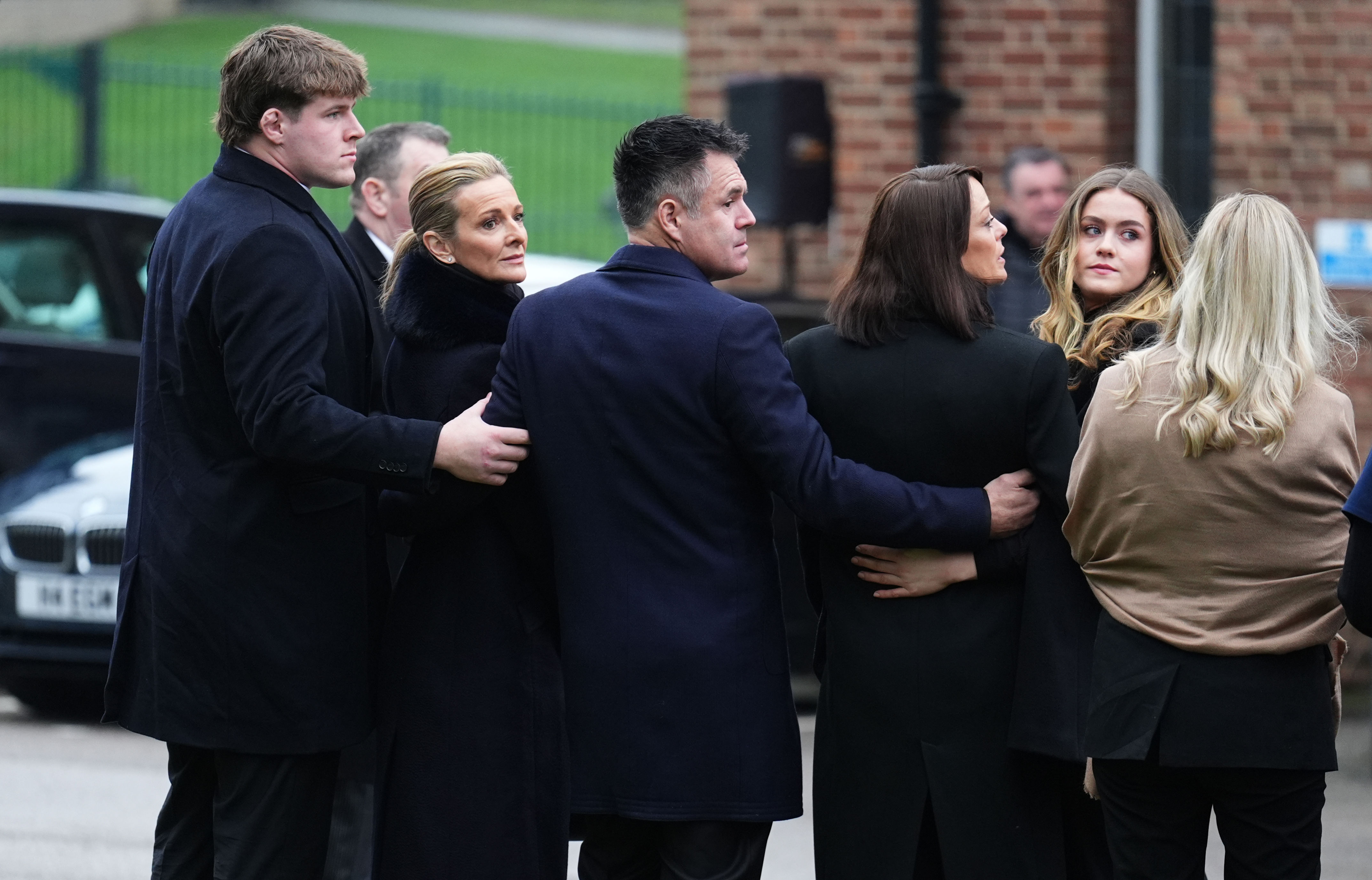 16 pictures as football greats and family attend funeral of Leeds ...