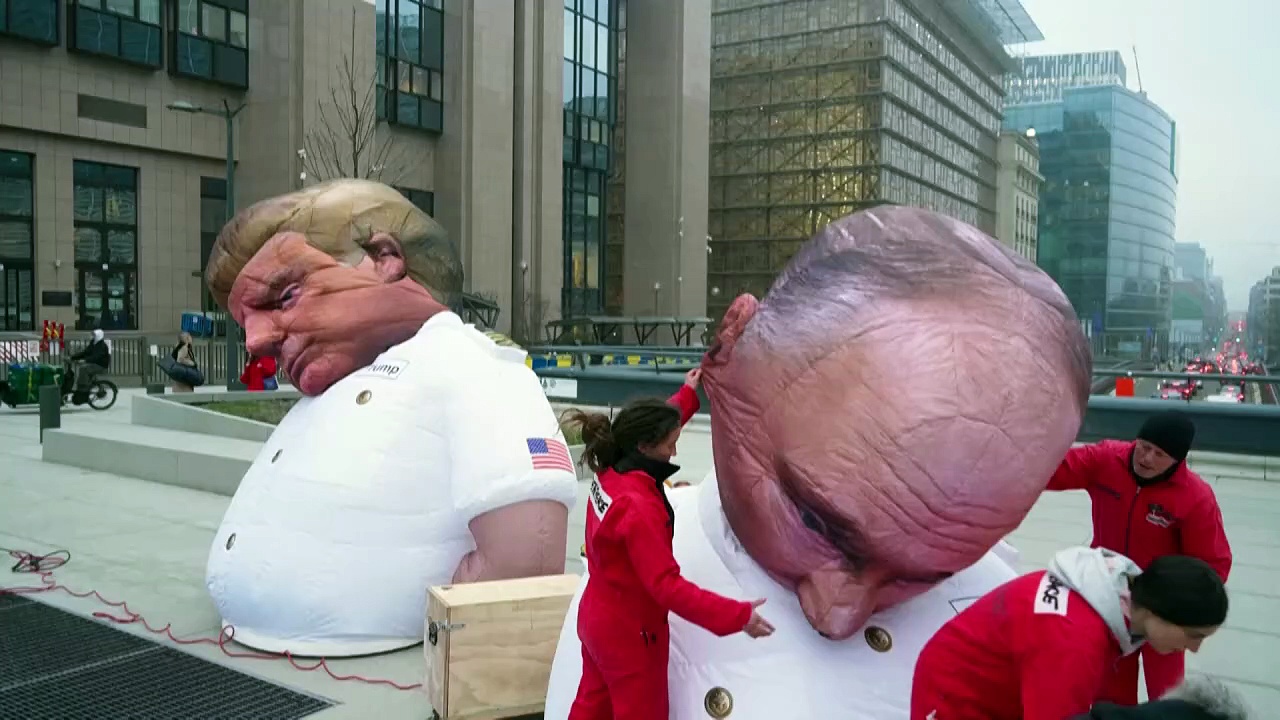 Greenpeace dévoile des effigies de Trump et Poutine à Bruxelles, somme ...