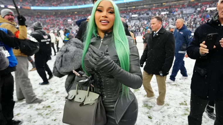 Cardi B bundles up in oversized fur coat and knee boots at Patriots AFC ...