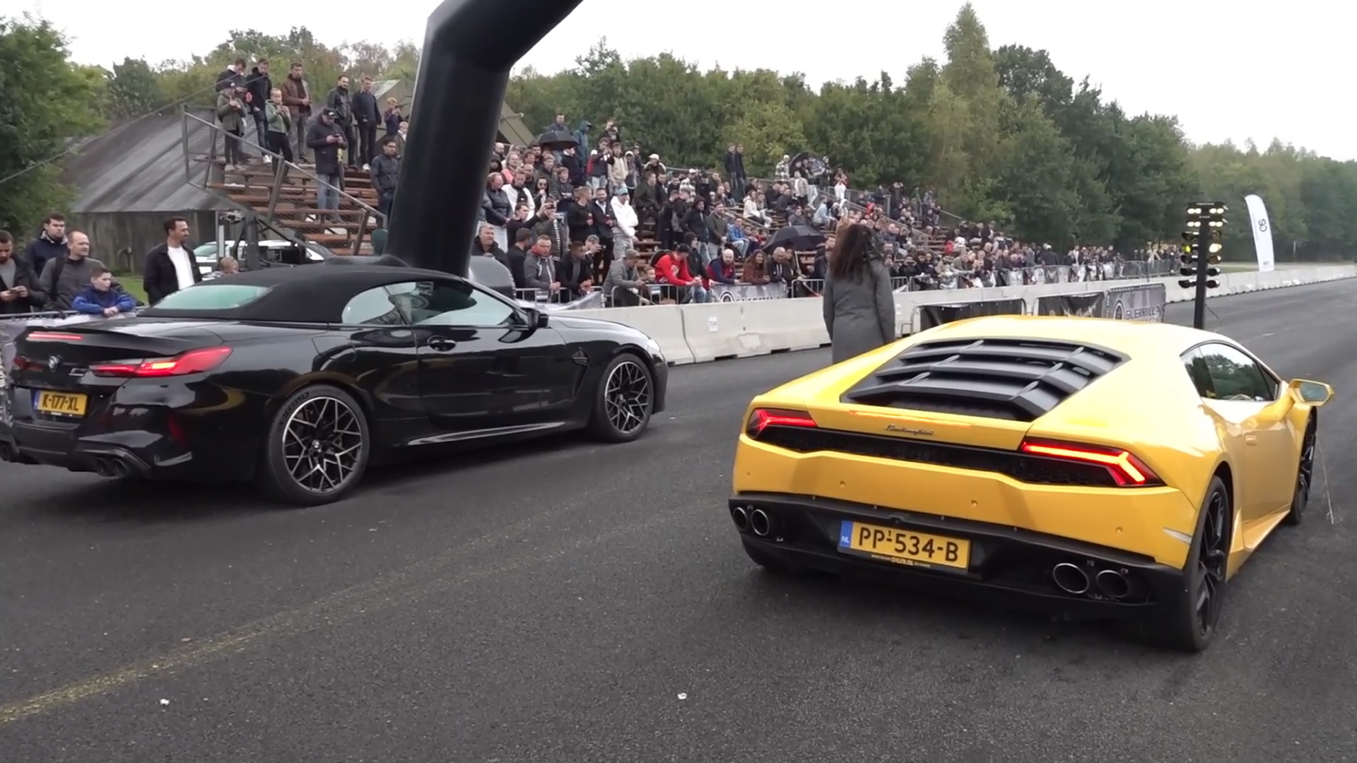 Modern sports cars compete in straight-line races