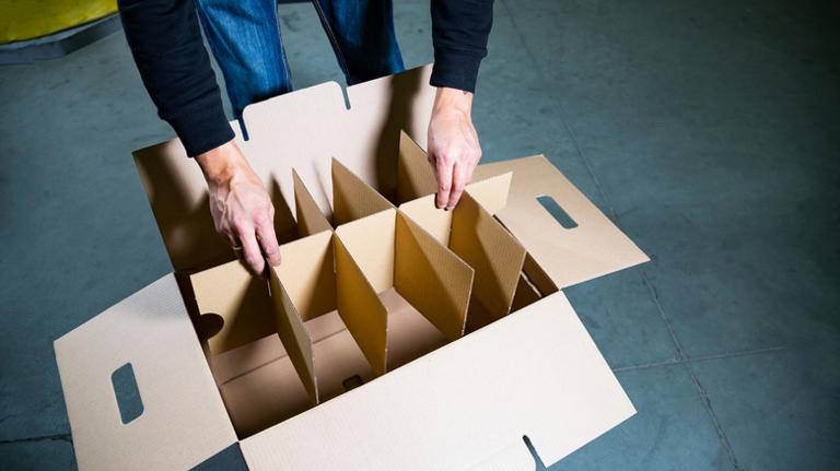 Reusing cardboard makes kitchen utensil organization cheap and simple