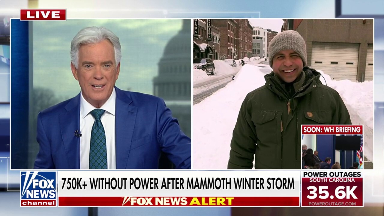 Boston residents work hard to clear cars after massive snow fall