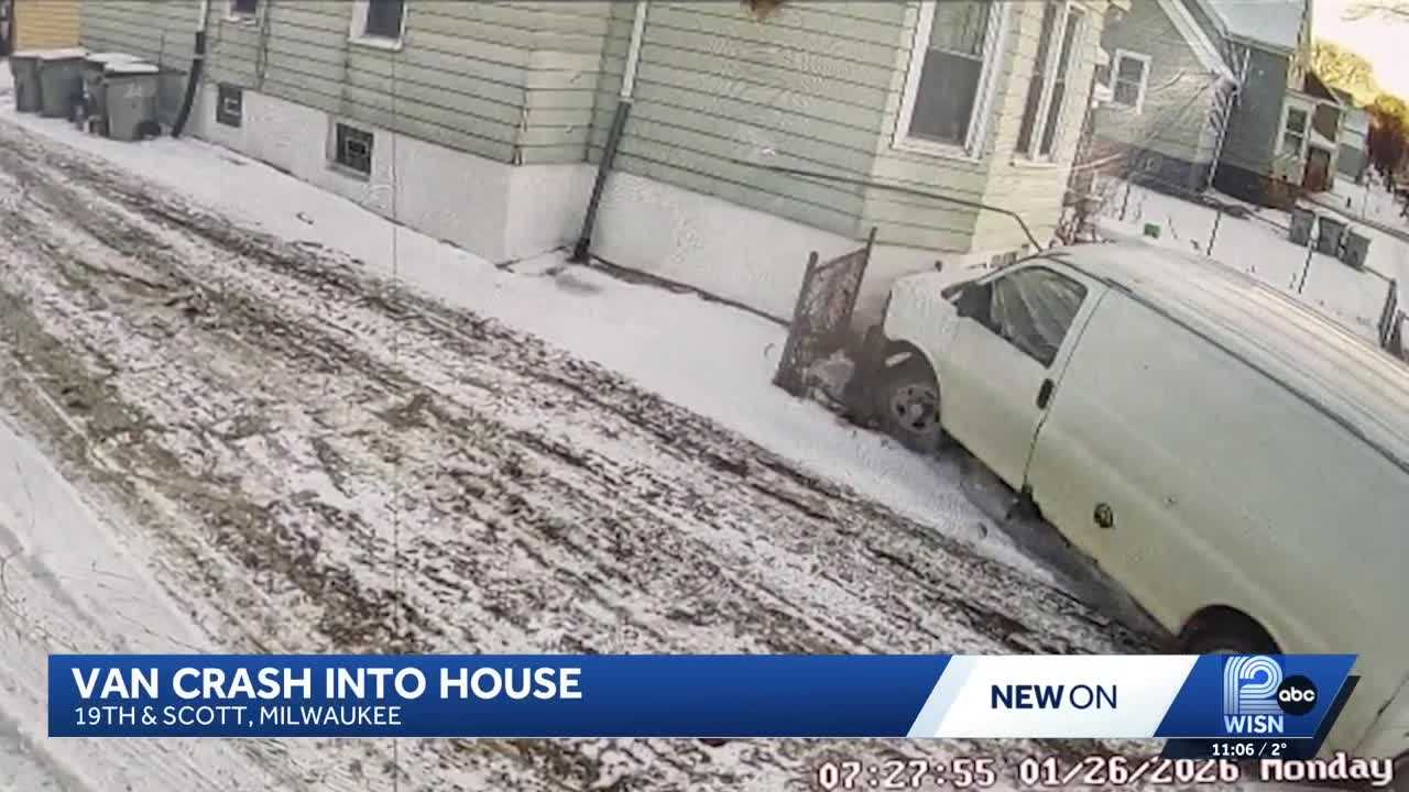 Surveillance video captures van crashing into home
