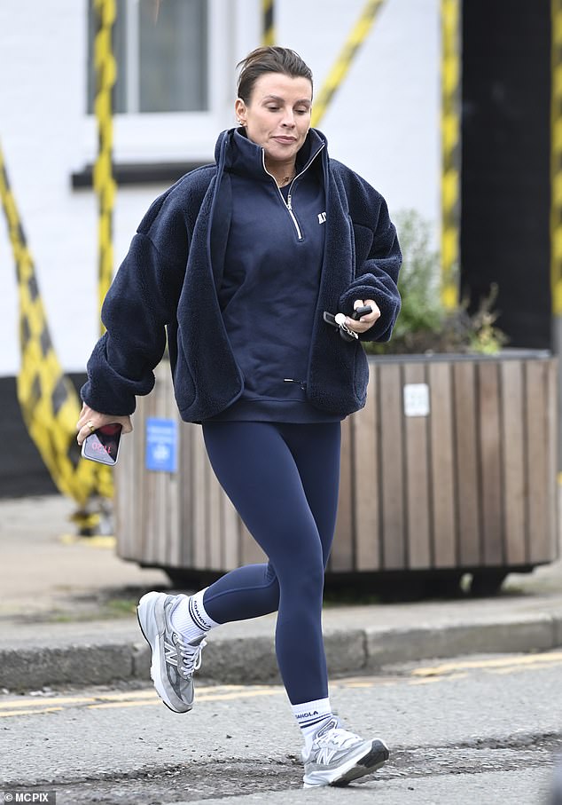 Coleen Rooney looks chic in navy workout gear as she leaves a beauty ...