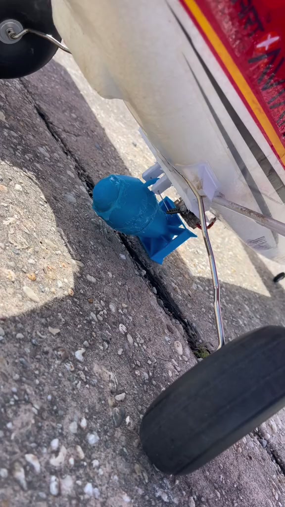 Teen tests 3D printed payload drop on RC plane