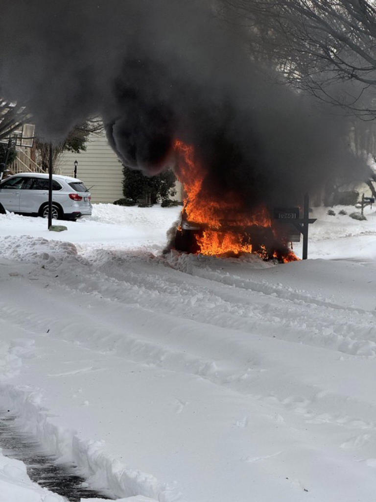 Photos: Pickup truck stuck in snow catches fire in Montgomery County
