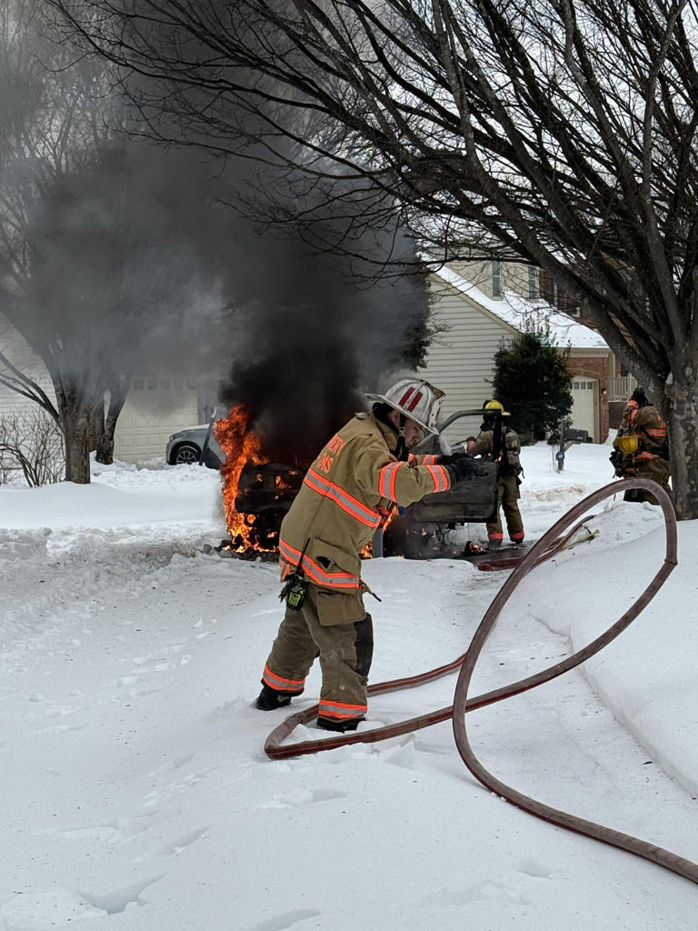 Photos: Pickup truck stuck in snow catches fire in Montgomery County