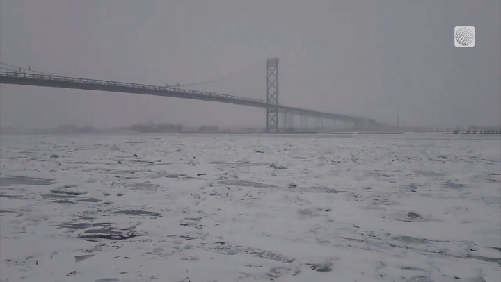 Storm moves in over a frozen Detroit River in Windsor, ON