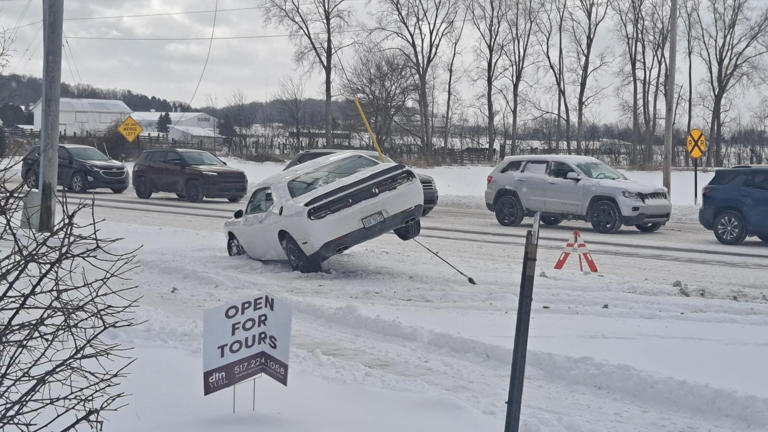 Car crashes into power line, leading to closure of Okemos intersection