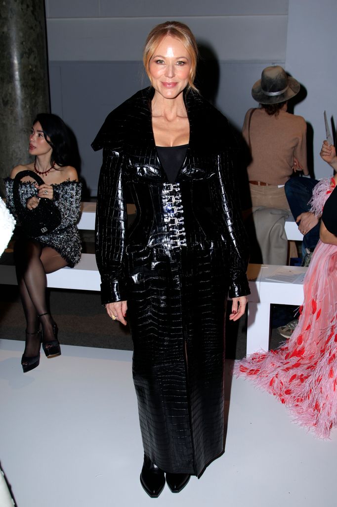 Jewel, 51, stuns in black leather corset and sheer tights for Paris ...