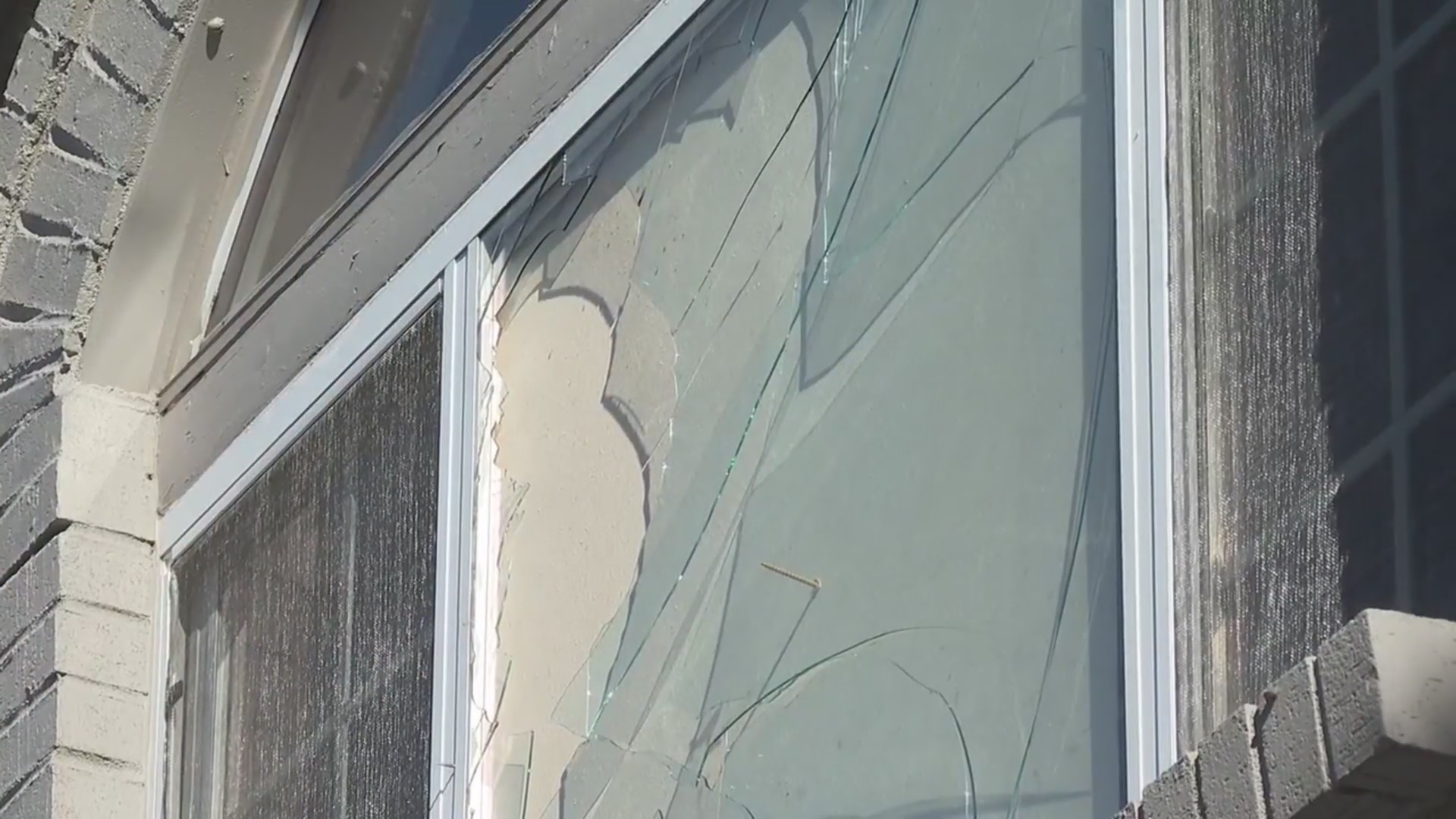 Rock thrown through window nearly hits child in Englewood