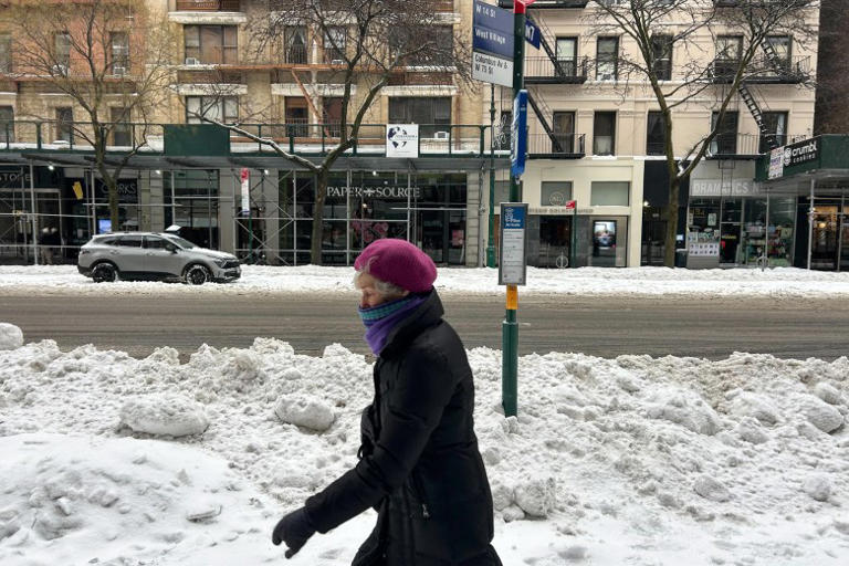 Climbing bus stop mountain: Snowfall makes a mess of wheeled commutes