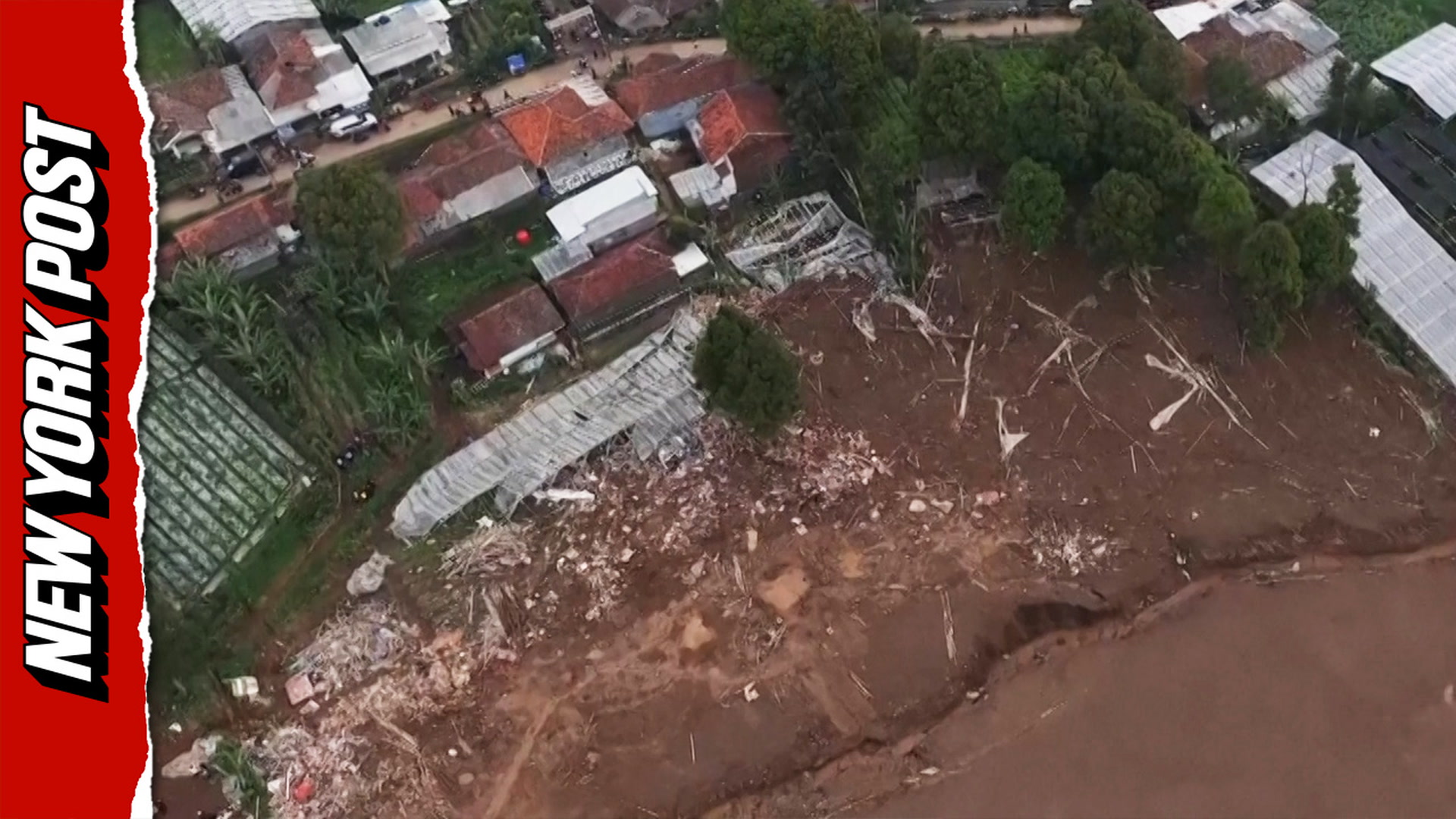 Dramatic drone footage shows homes buried after massive landslide in ...