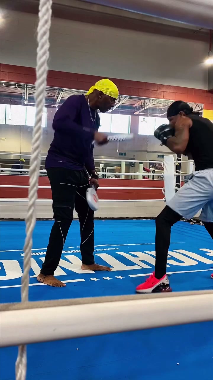 Deric "Scooter" Davis 🦈 working the paddle pads with coach Barry Hunter