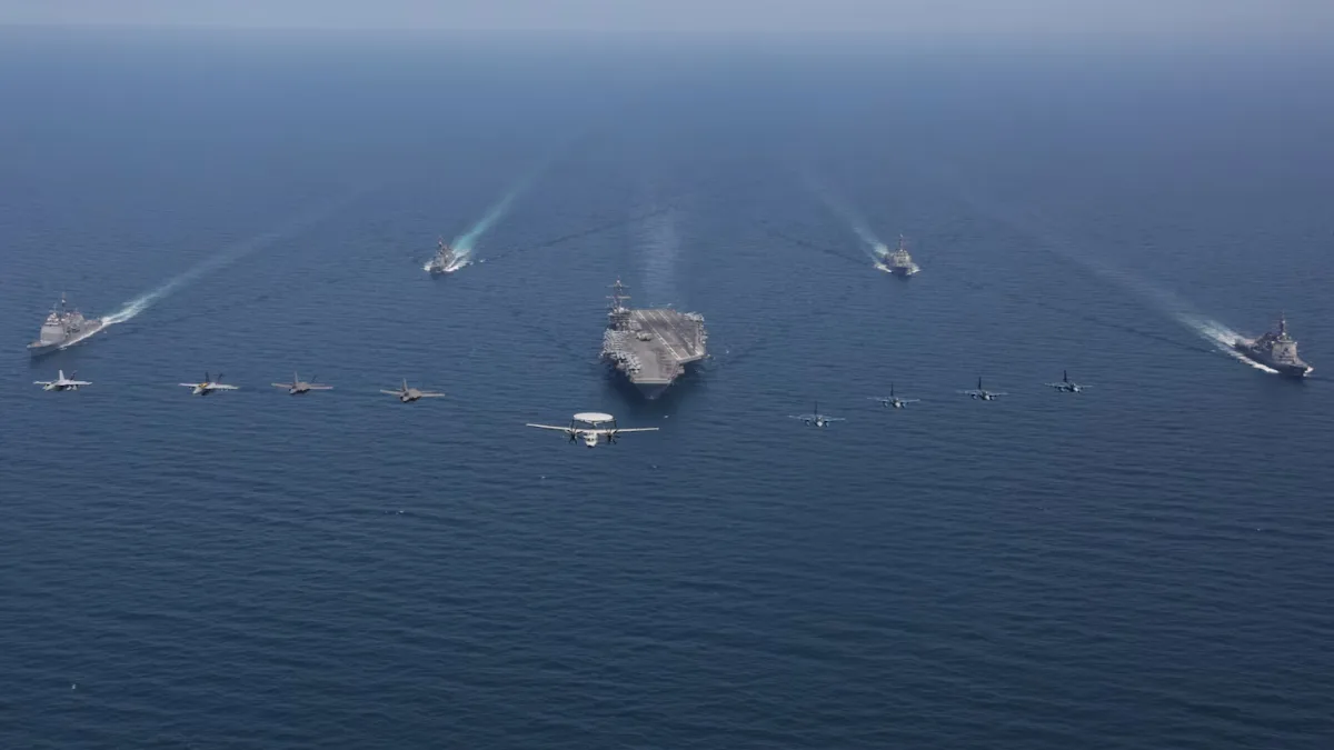 US carrier strike group enters Middle East; Iran issues 'finger on the ...