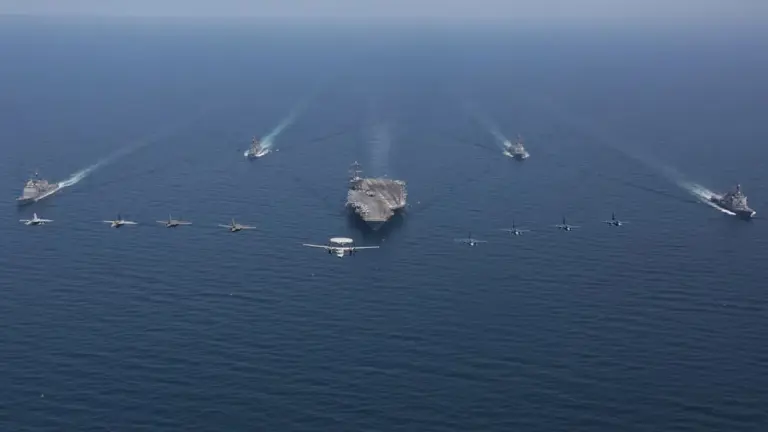 US carrier strike group enters Middle East; Iran issues 'finger on the ...