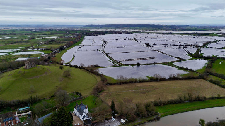 Flooding shuts schools and causes travel disruption