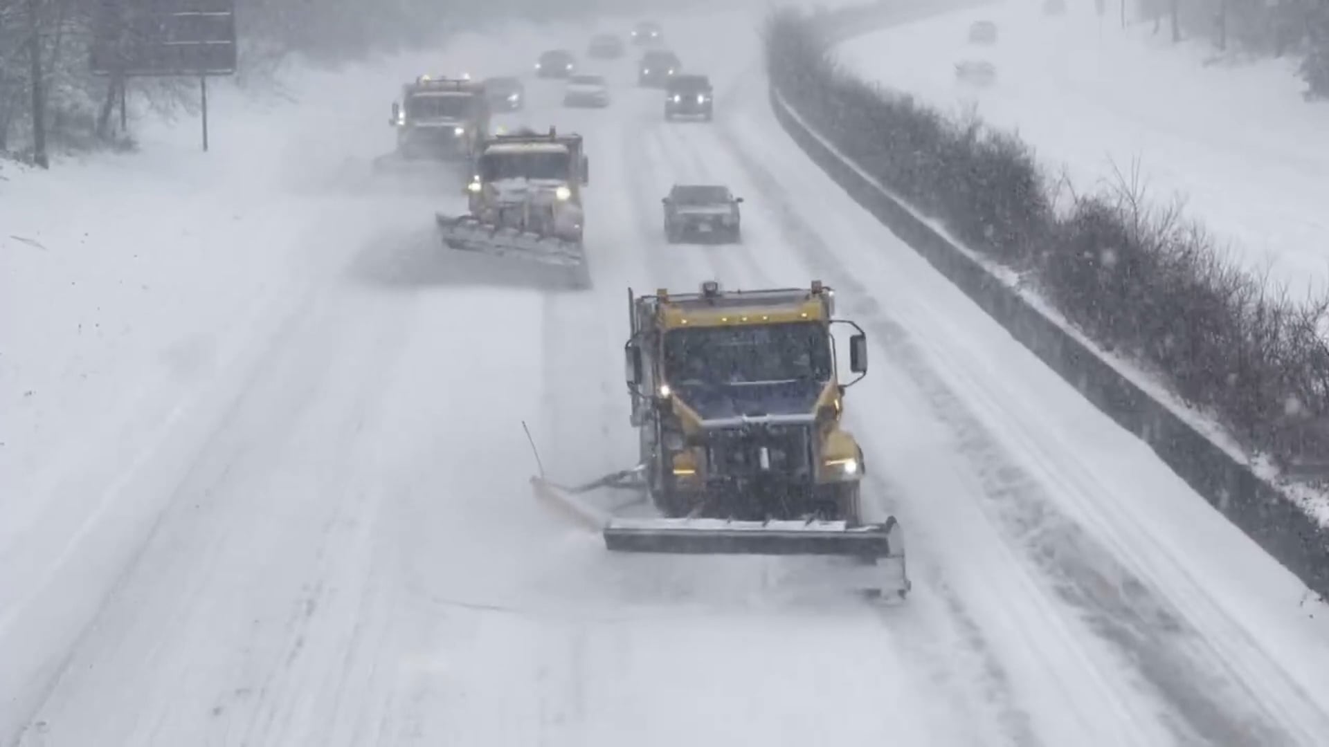 Snow plows clear street in Long Island, NY