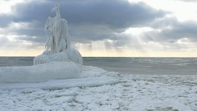 Massive ice boulders bob along Lake Michigan shore