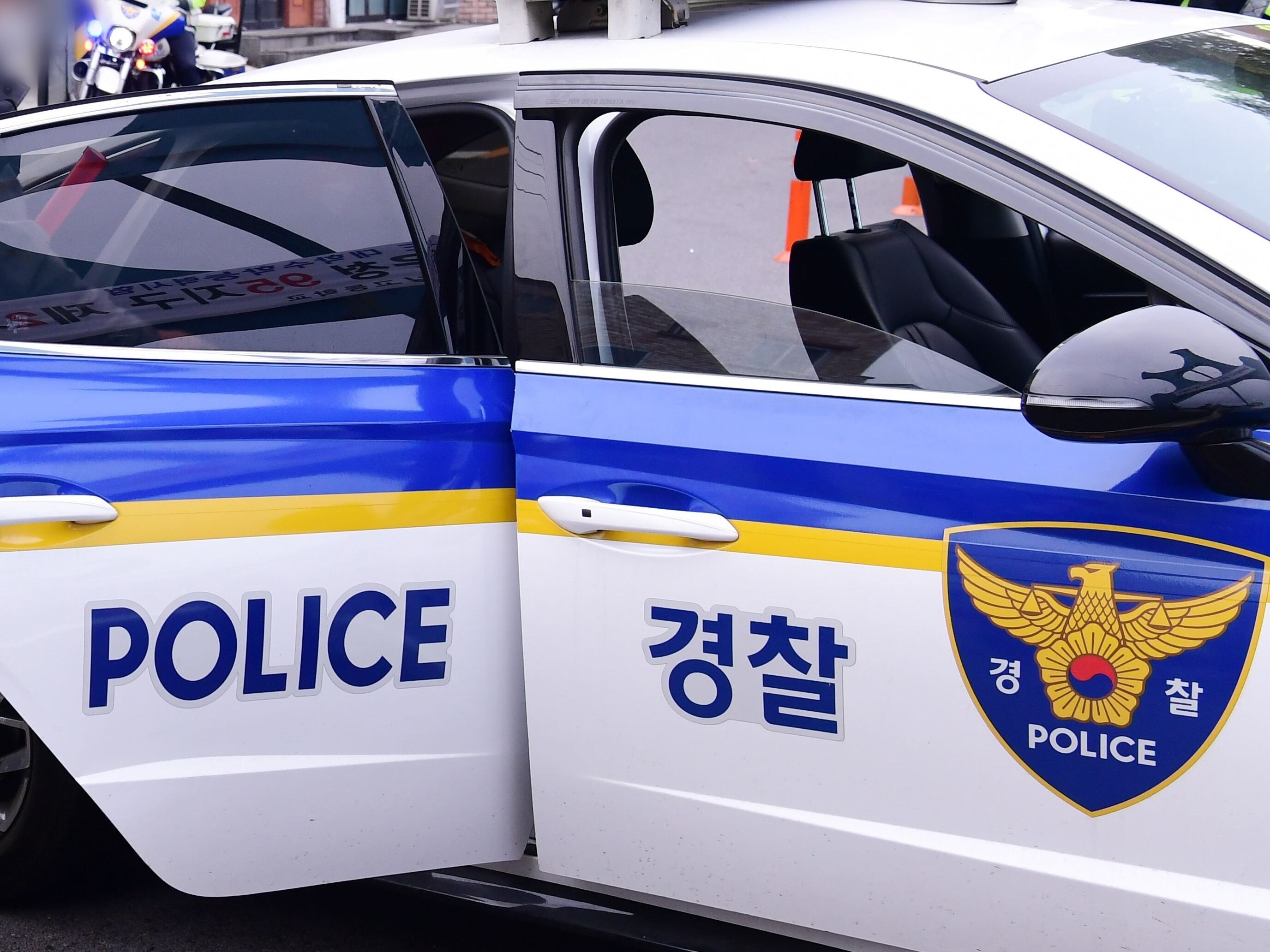 Man arrested for brandishing weapon in banner dispute