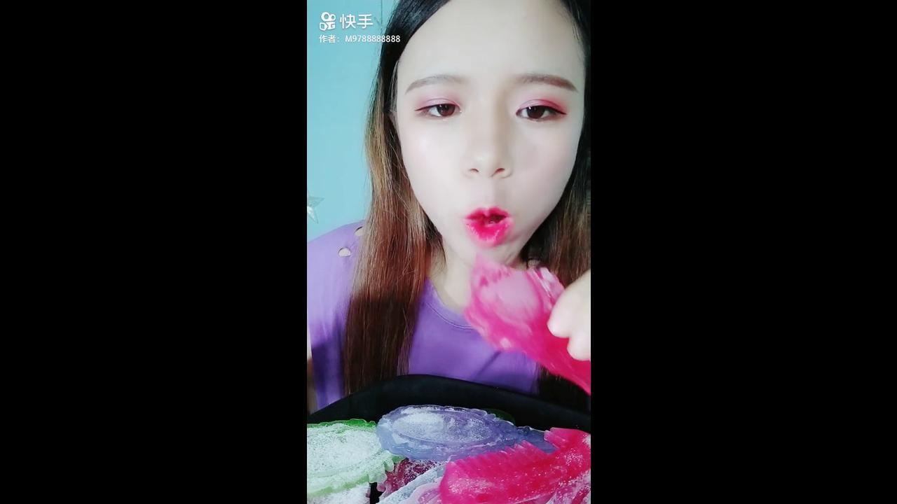 Eating satisfying jelly candy in mirror shapes with pastel pink and ...