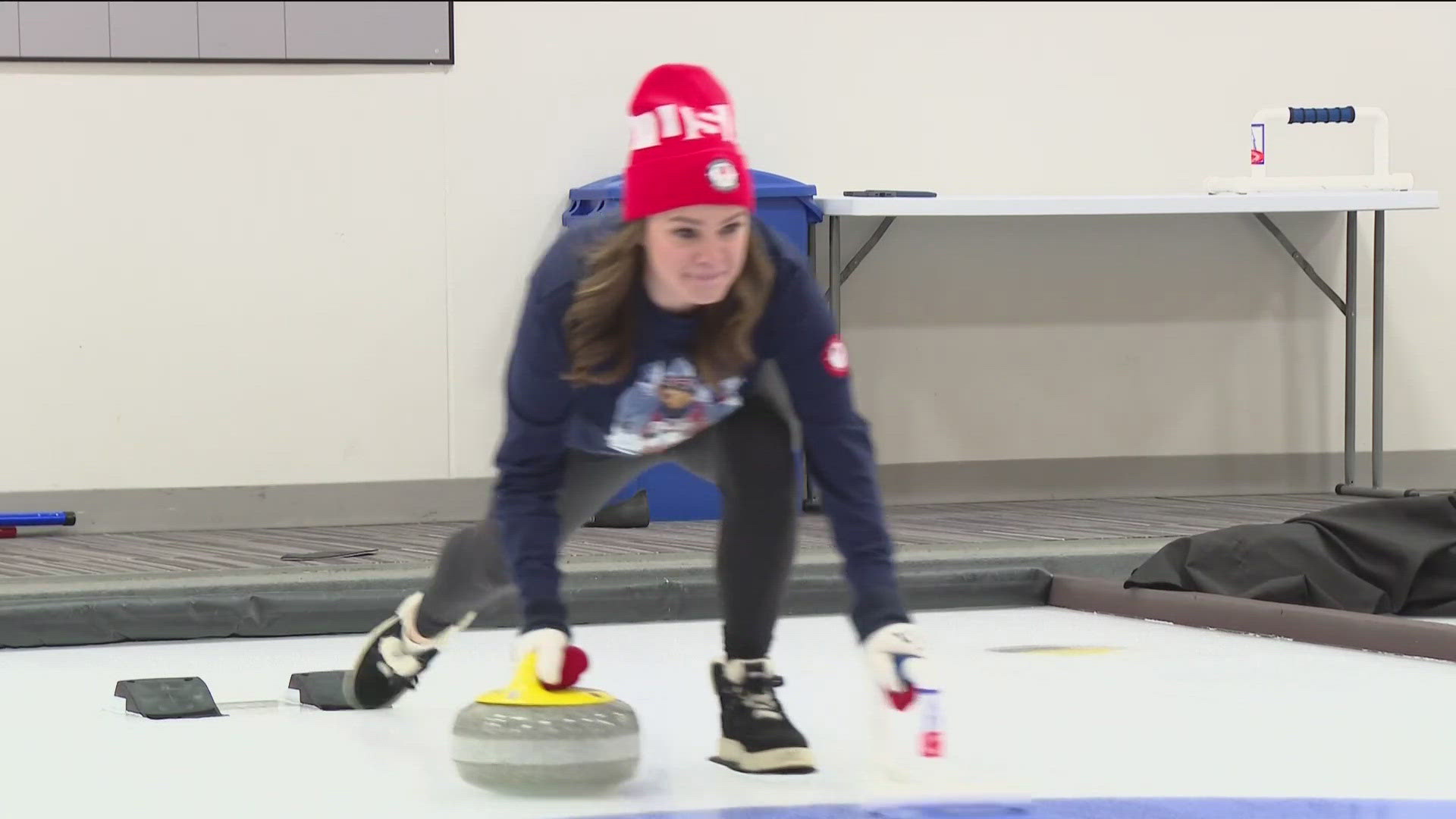 KARE 11 Sunrise anchors learn to throw a stone in curling