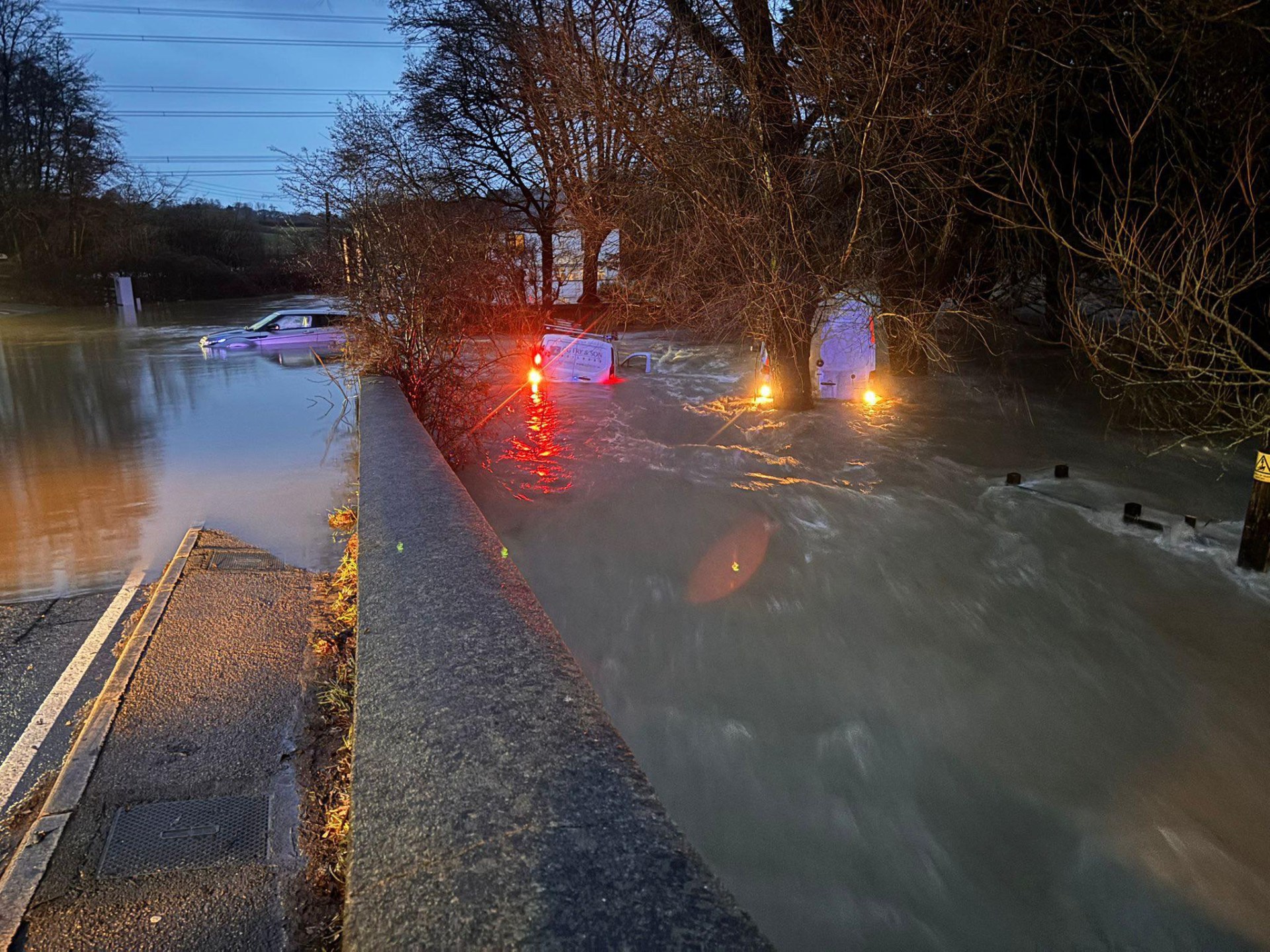 Drivers rescued from cars after Storm Chandra flooding