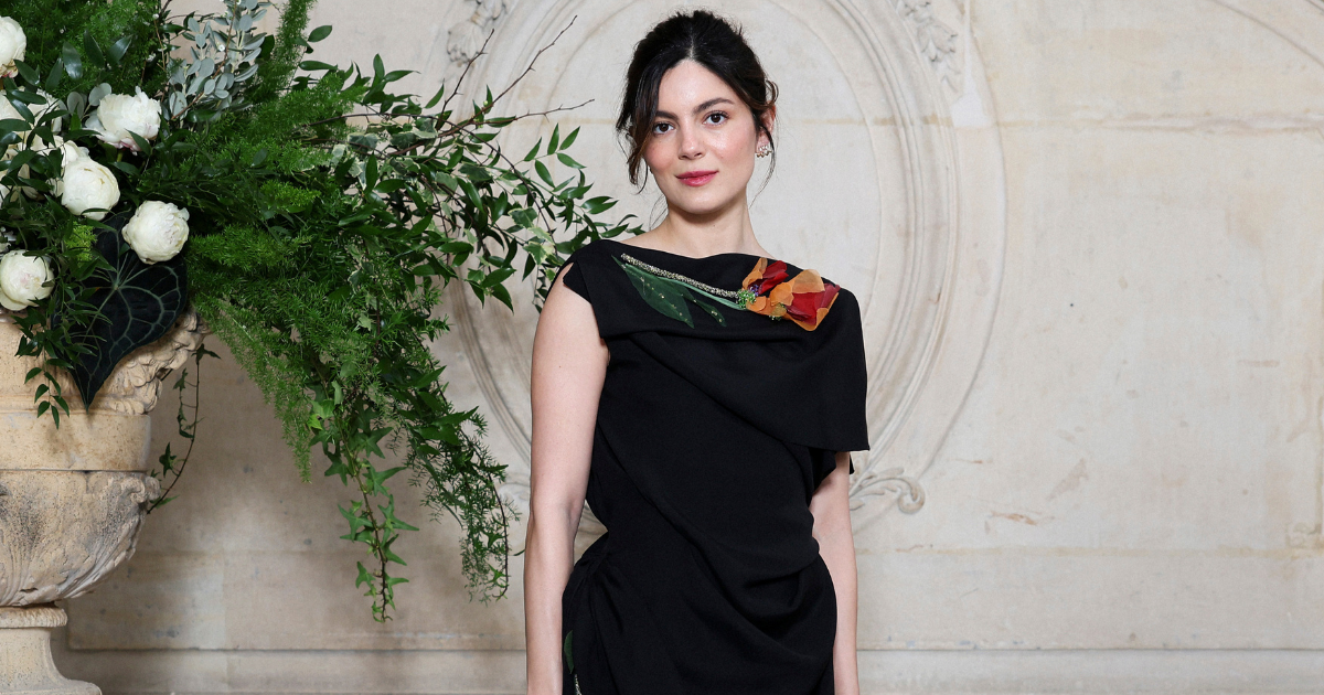 Monica Barbaro's all-black draped Dior dress has a subtle pop of color
