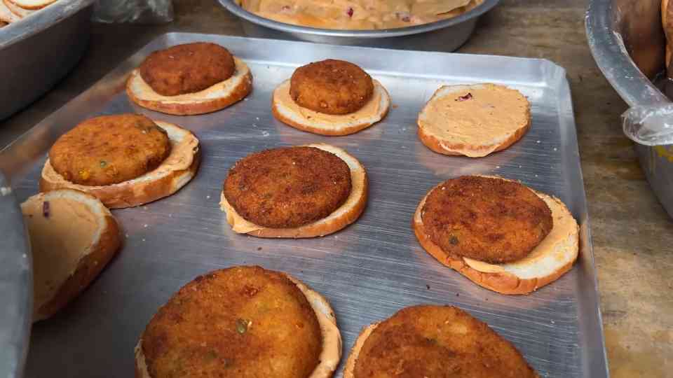 This is how a veg cheese burger is made in a village kitchen