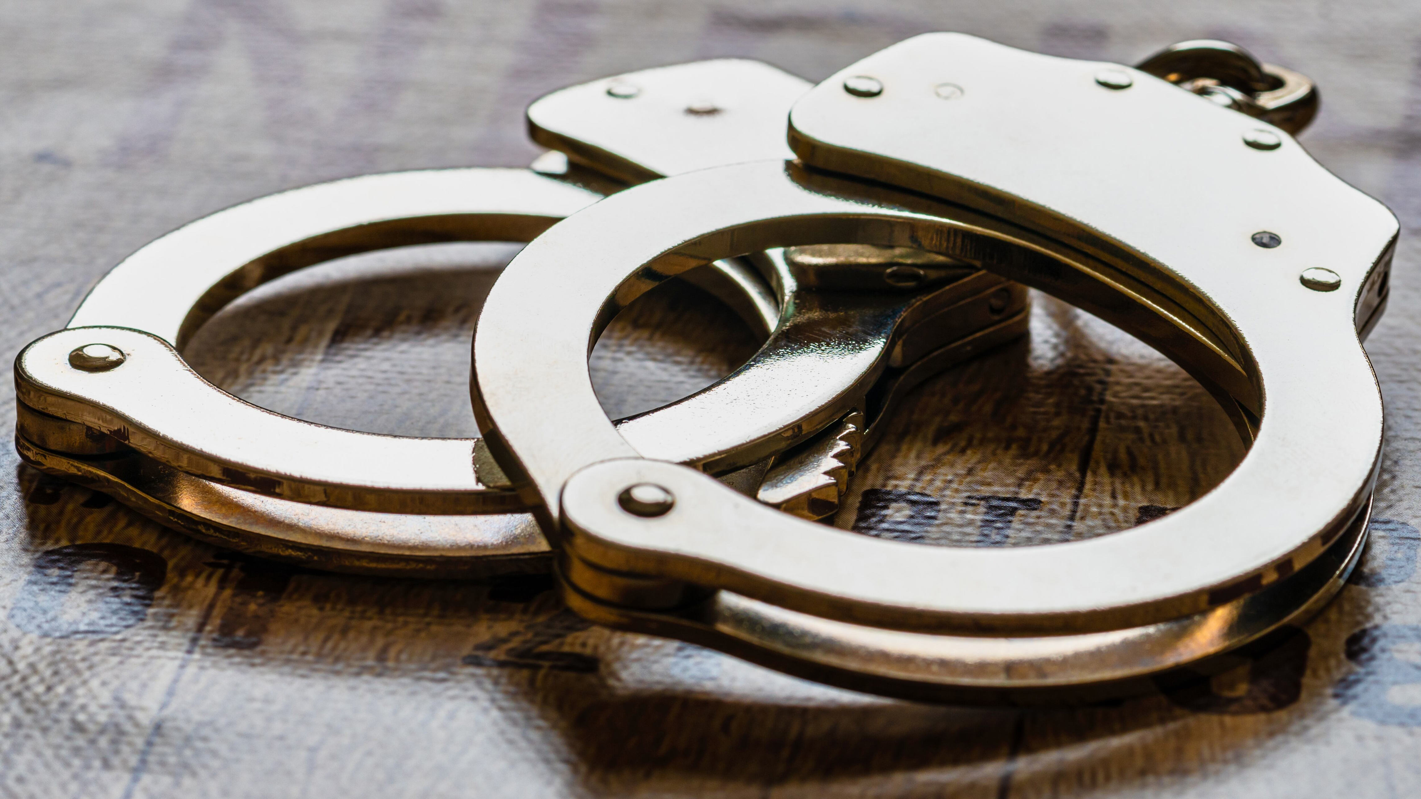 Standoff ends when fugitive falls from attic into motel room, police say