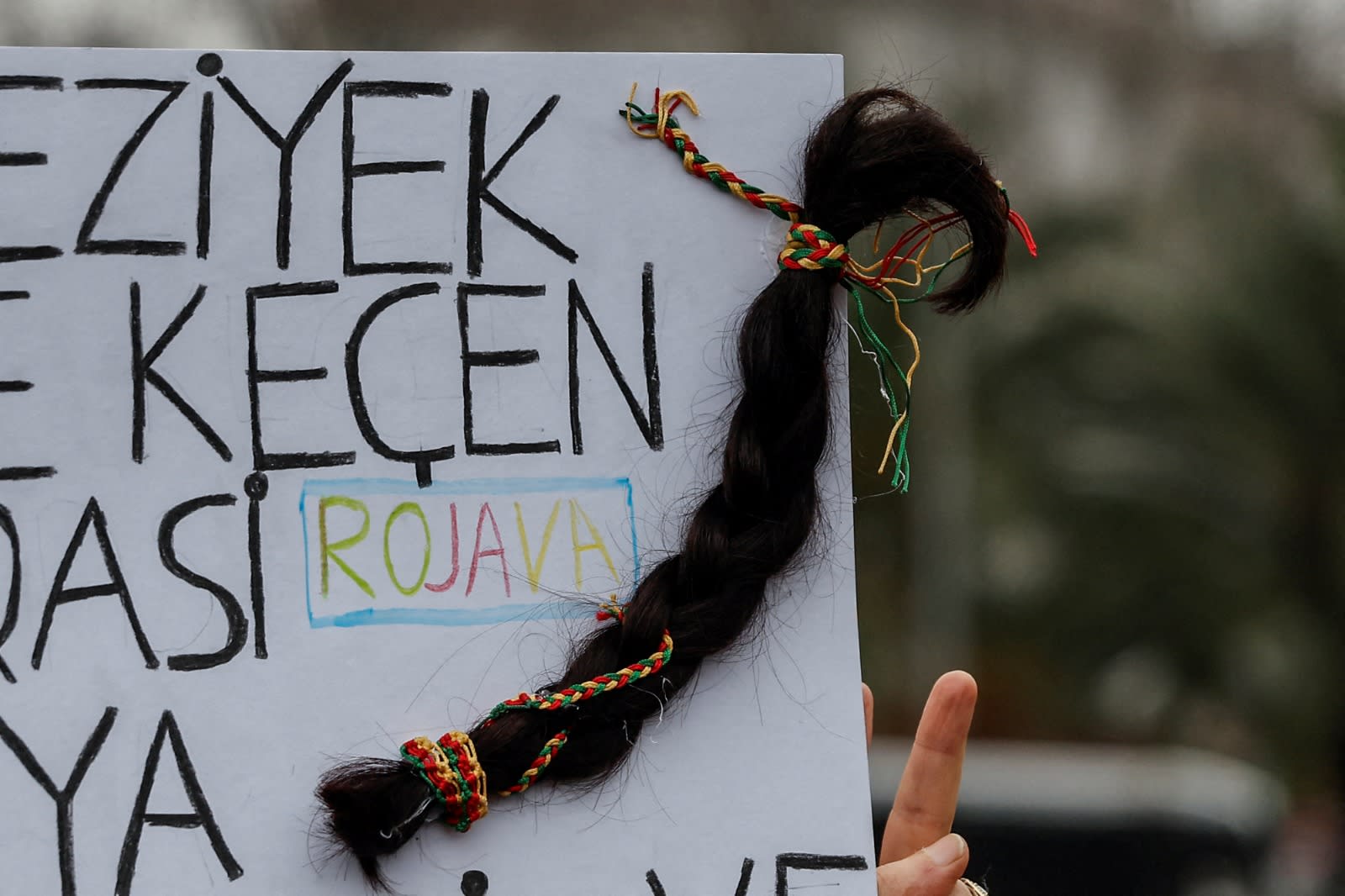 Kurdish women turn braids into symbol of resistance after Syria atrocities