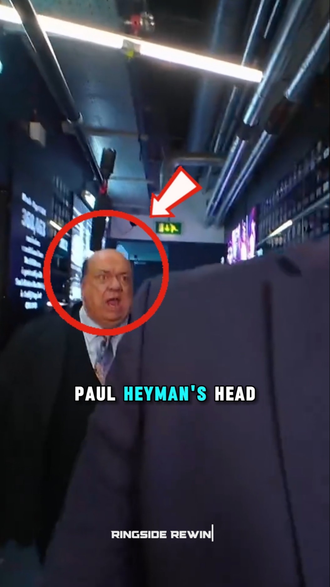 Paul Heyman gets hit in the head with a mic!
