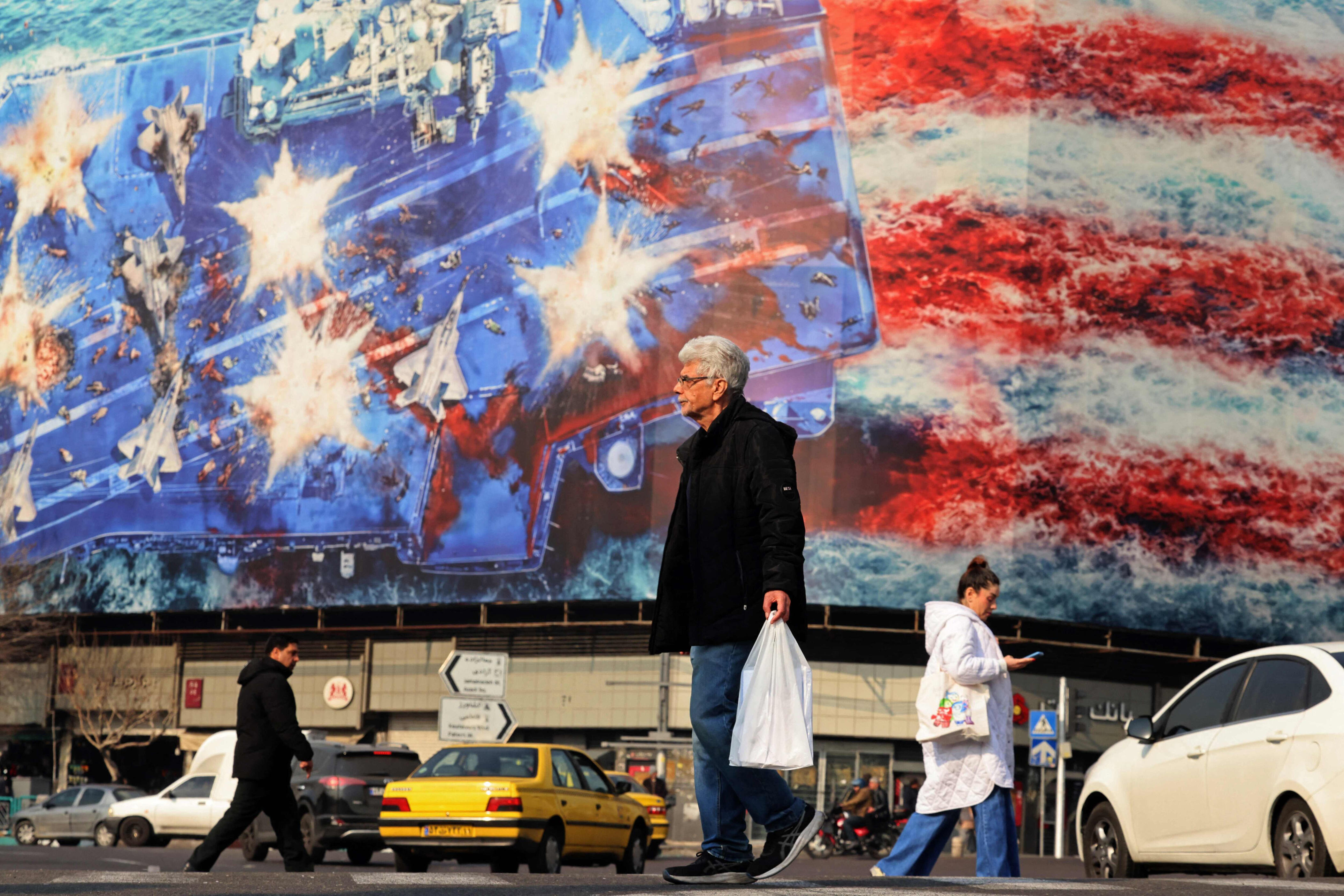 US carrier strike group deploys as Iran protests mark one month