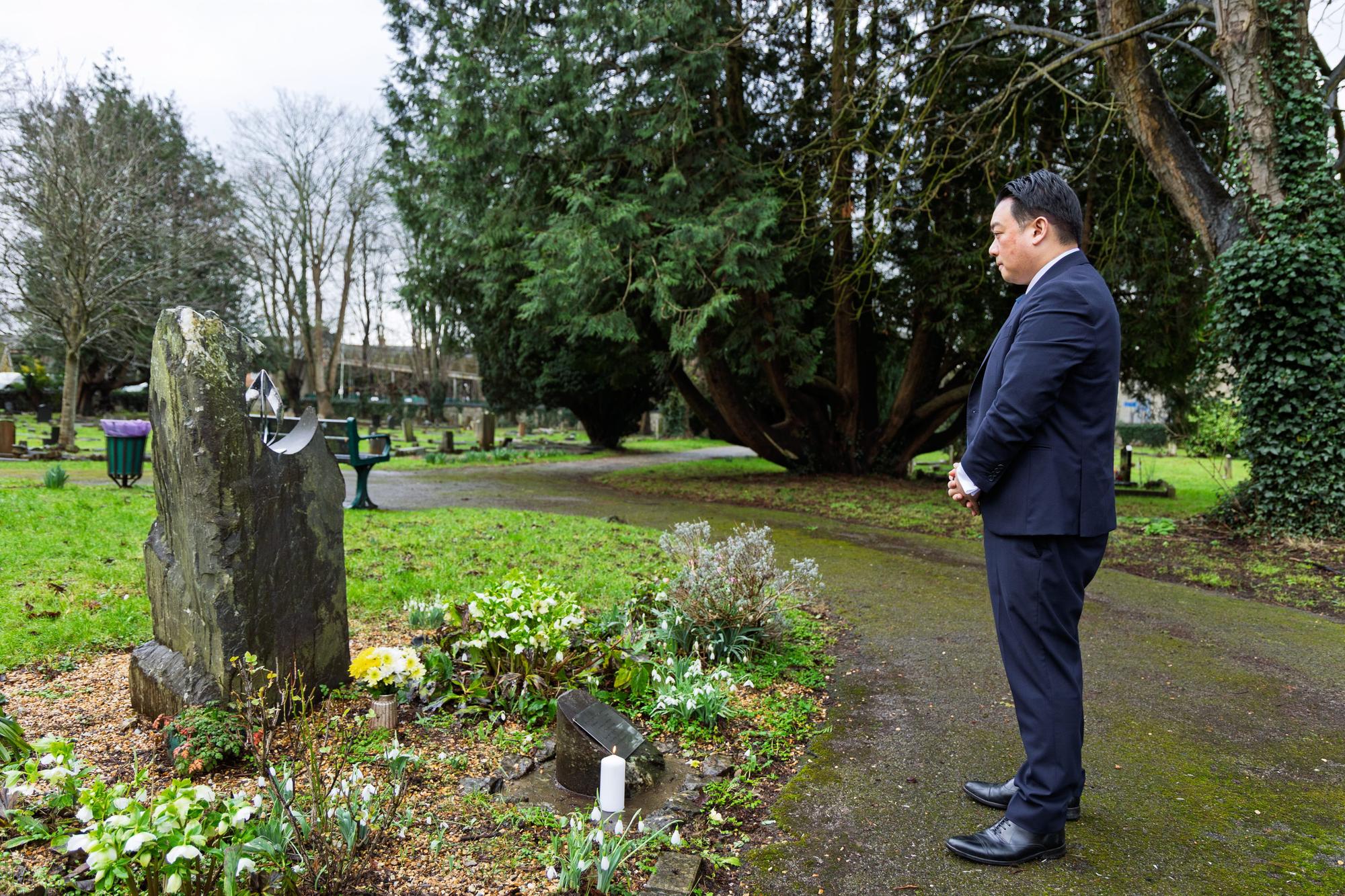 Havant MP Alan Mak lights candle in Havant Cemetery to mark Holocaust ...