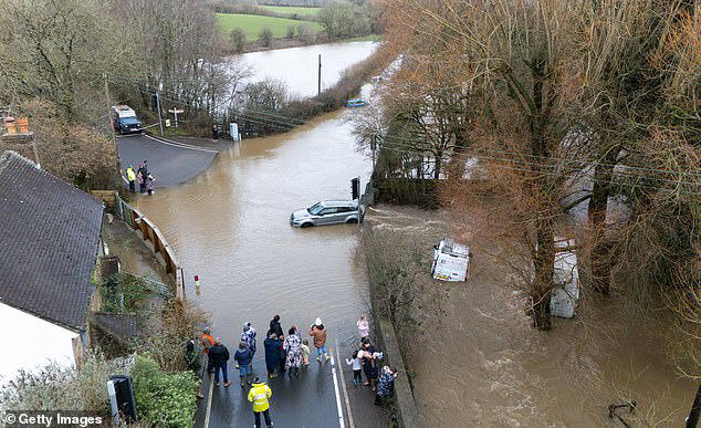 Flooded Britain on ice alert: Roads and pavements will freeze tonight ...