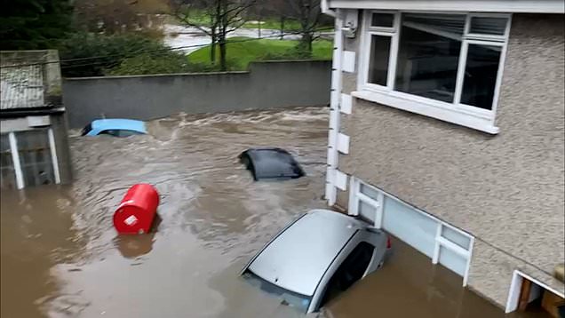 Cars float away in Storm Chandra floodwater in Ireland and UK