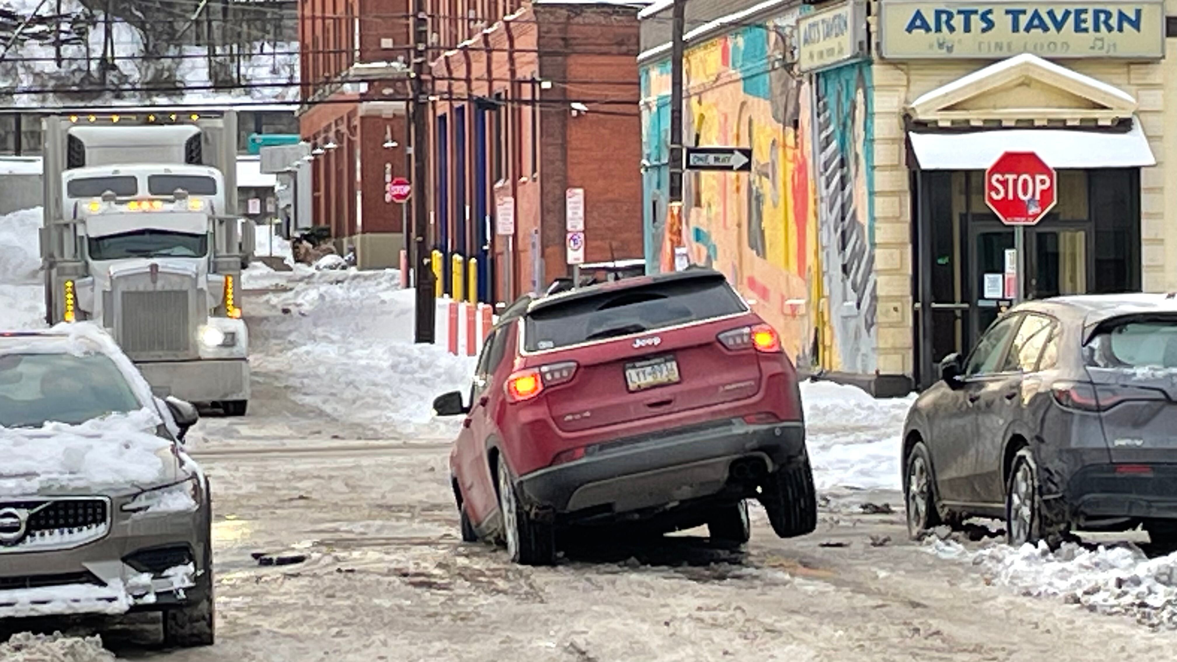 Vehicle stuck in sinkhole caused by water main break in Pittsburgh’s ...