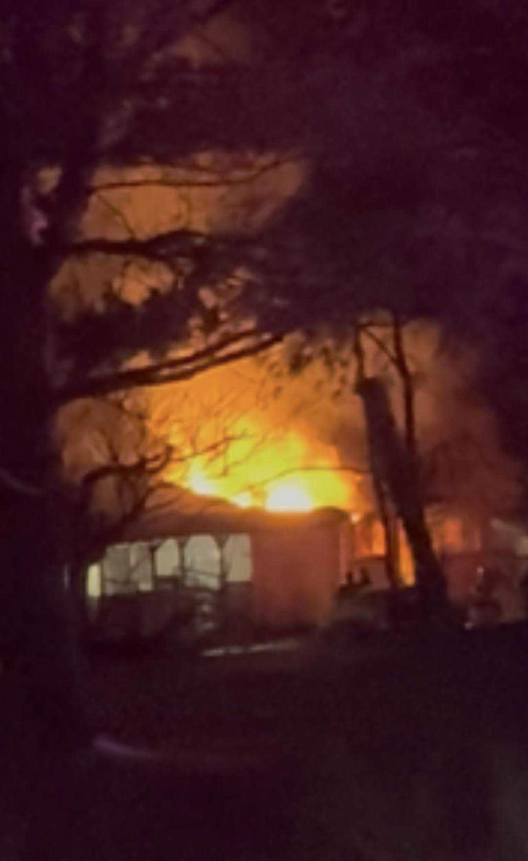 Flames shoot from burning chicken coop