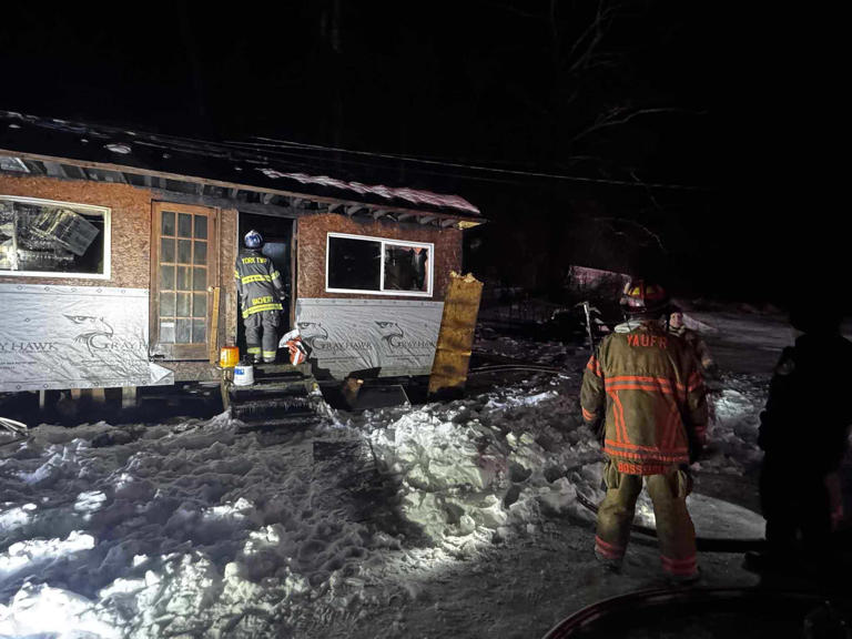 Flames shoot from burning chicken coop