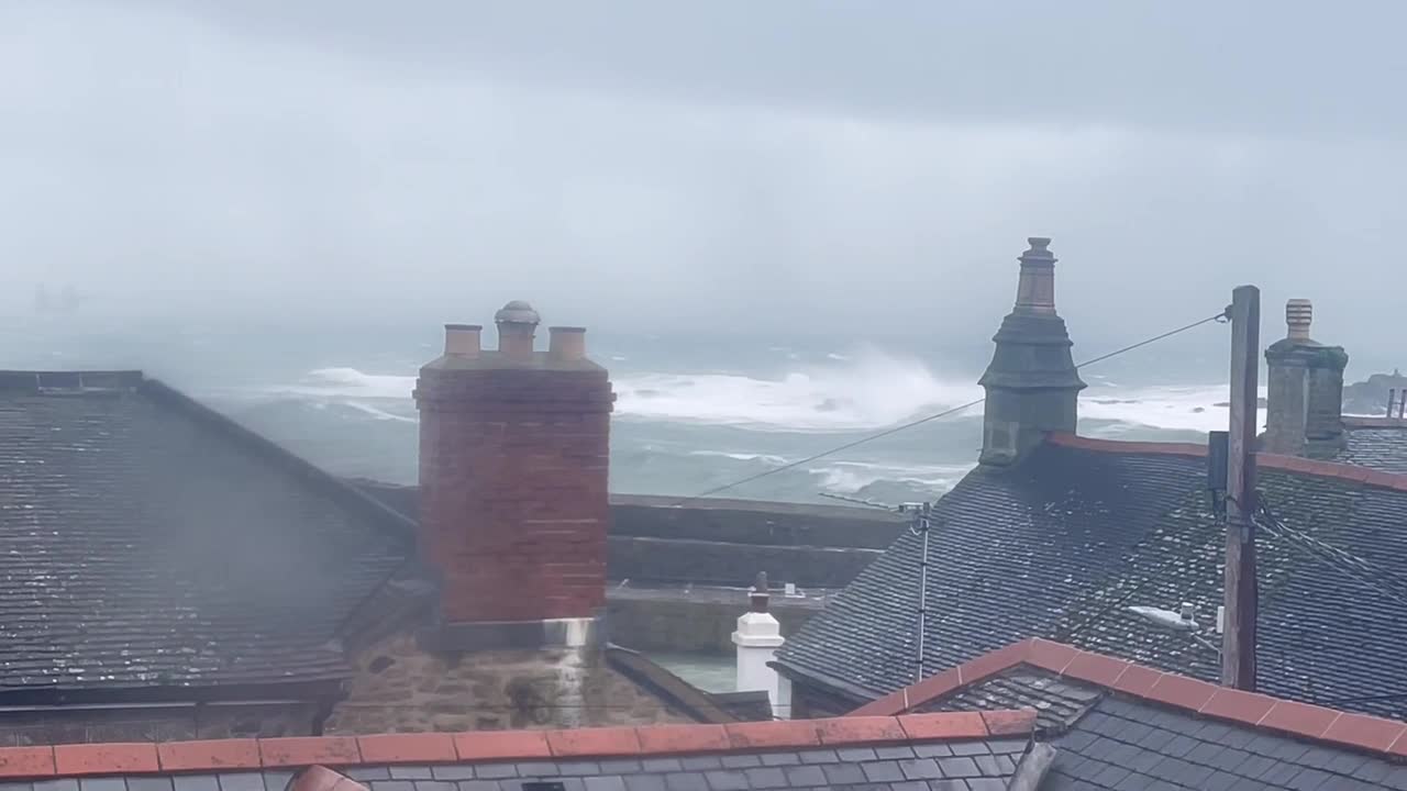 Storm Chandra: Huge waves crashing over Cornish seawall tower over houses