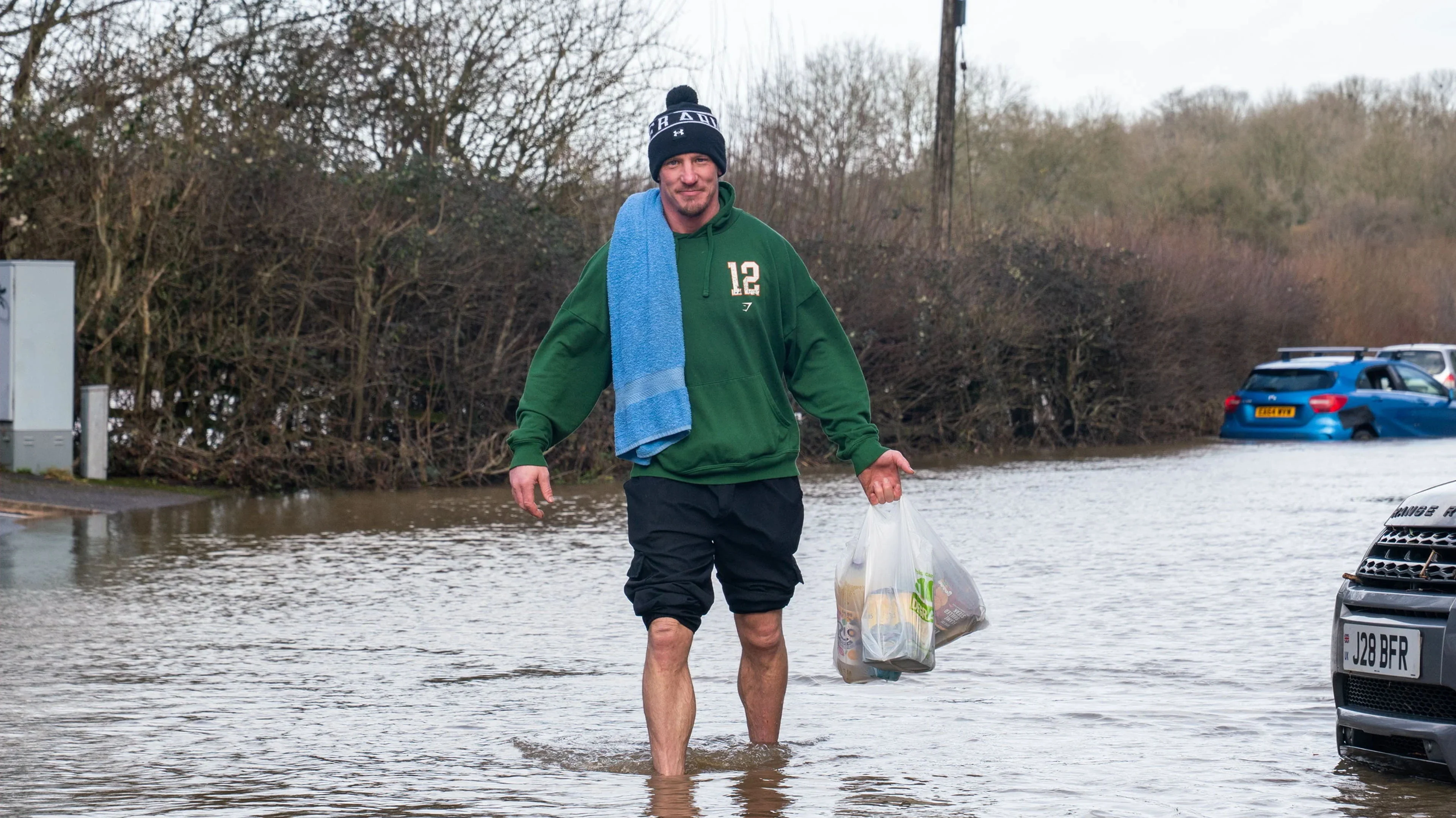 Dad wades through waist-deep floodwater to get food for kids as Storm ...