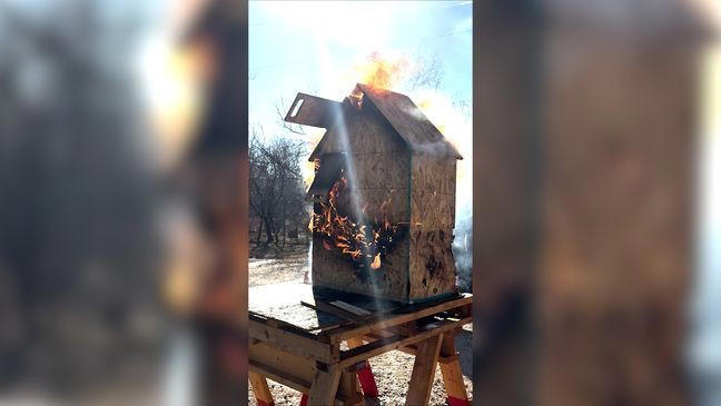 Abilene firefighters use a dollhouse to demonstrate airflow control and ...