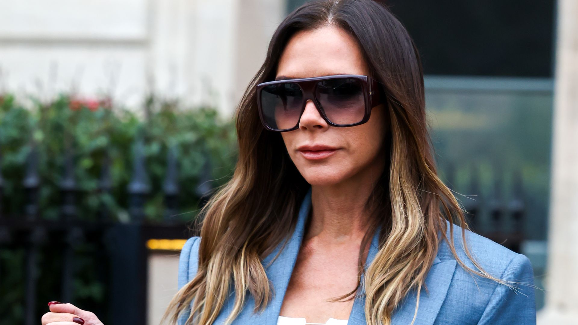 Victoria Beckham looks radiant in figure-hugging gown with thigh-high ...