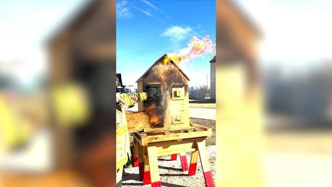 Abilene firefighters use a dollhouse to demonstrate airflow control and ...