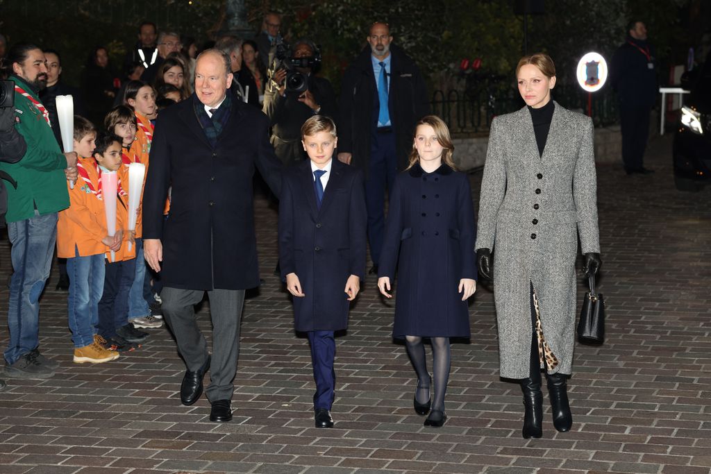 Princess Charlene is 'statuesque' in knee-high boots and £2.7k Prada bag